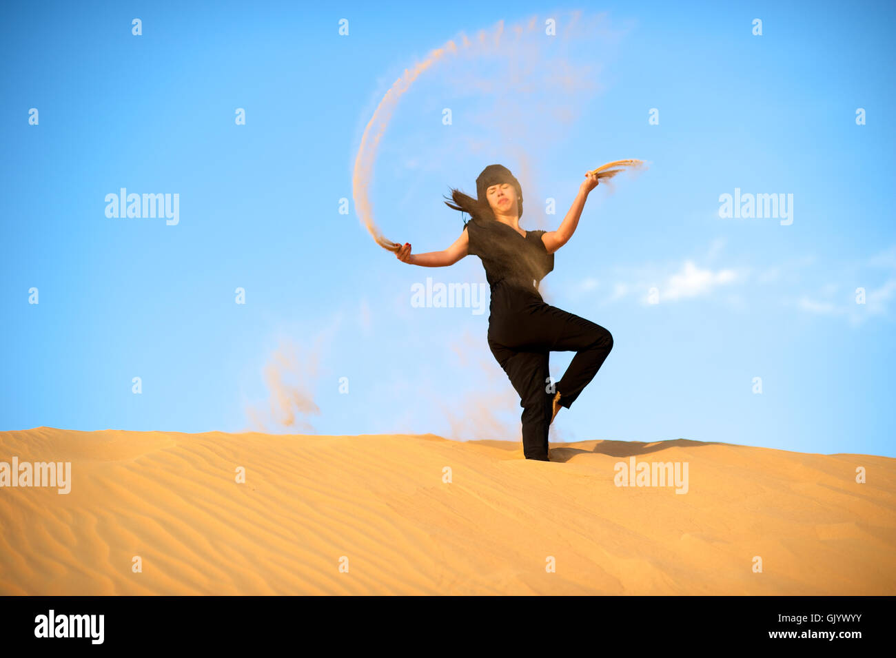Woman in the desert Stock Photo - Alamy