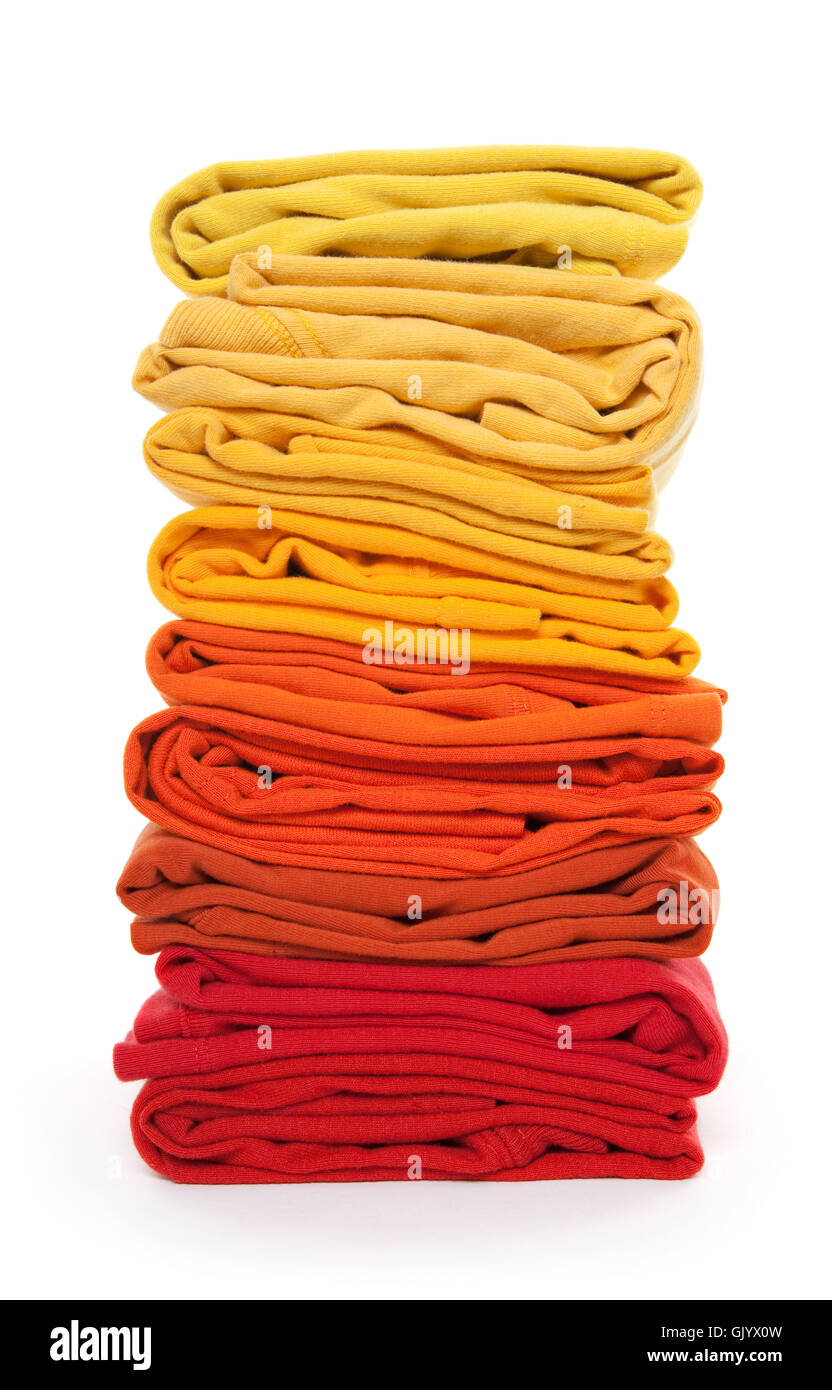 Pile of red and yellow folded clothes Stock Photo - Alamy
