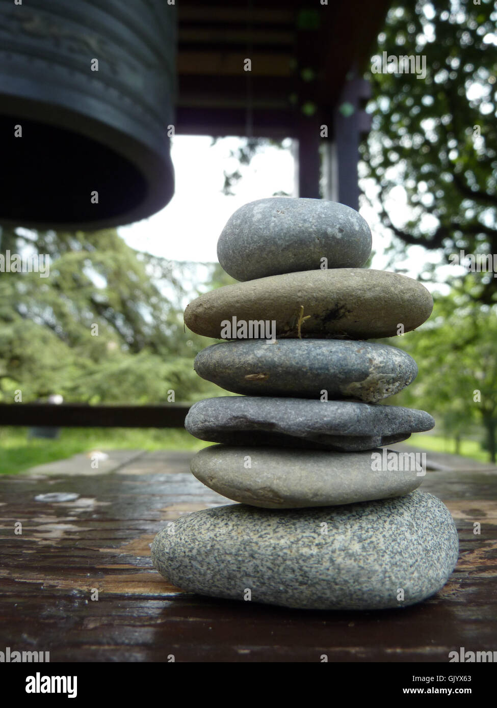 Zen stones and japanese bell Stock Photo - Alamy