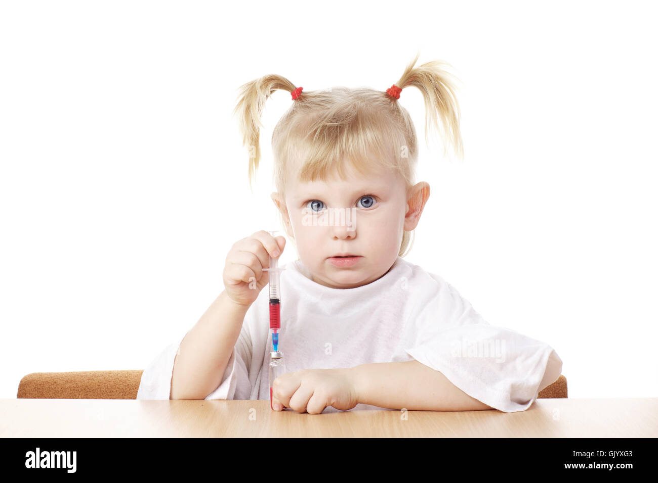 child playing with a syringe Stock Photo - Alamy