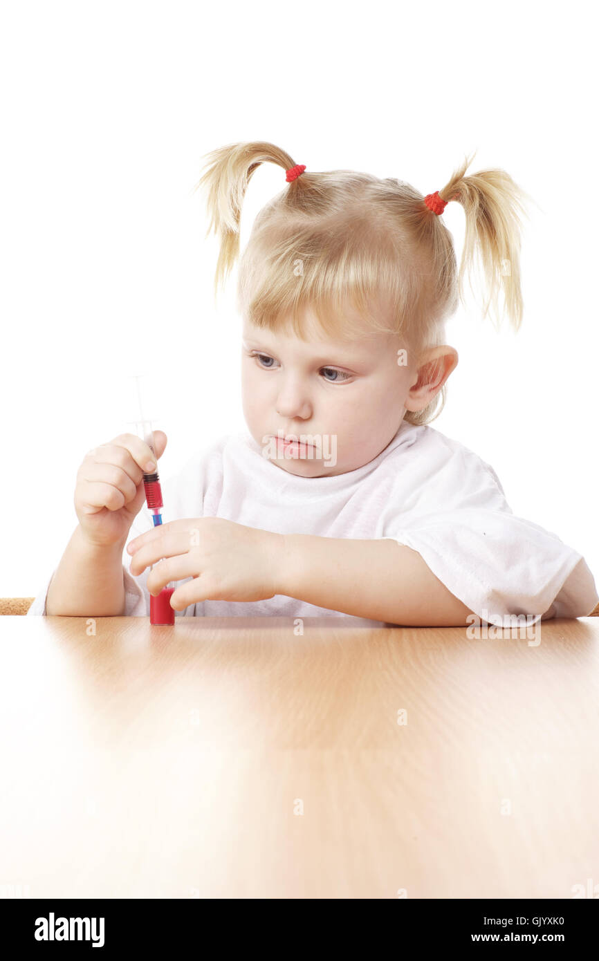 child playing with a syringe Stock Photo - Alamy