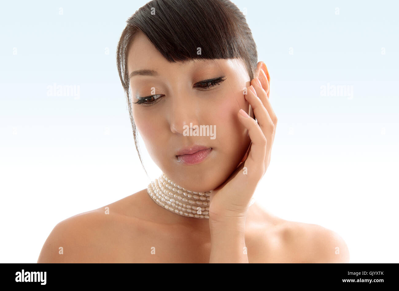 Beautiful woman thinking Stock Photo - Alamy