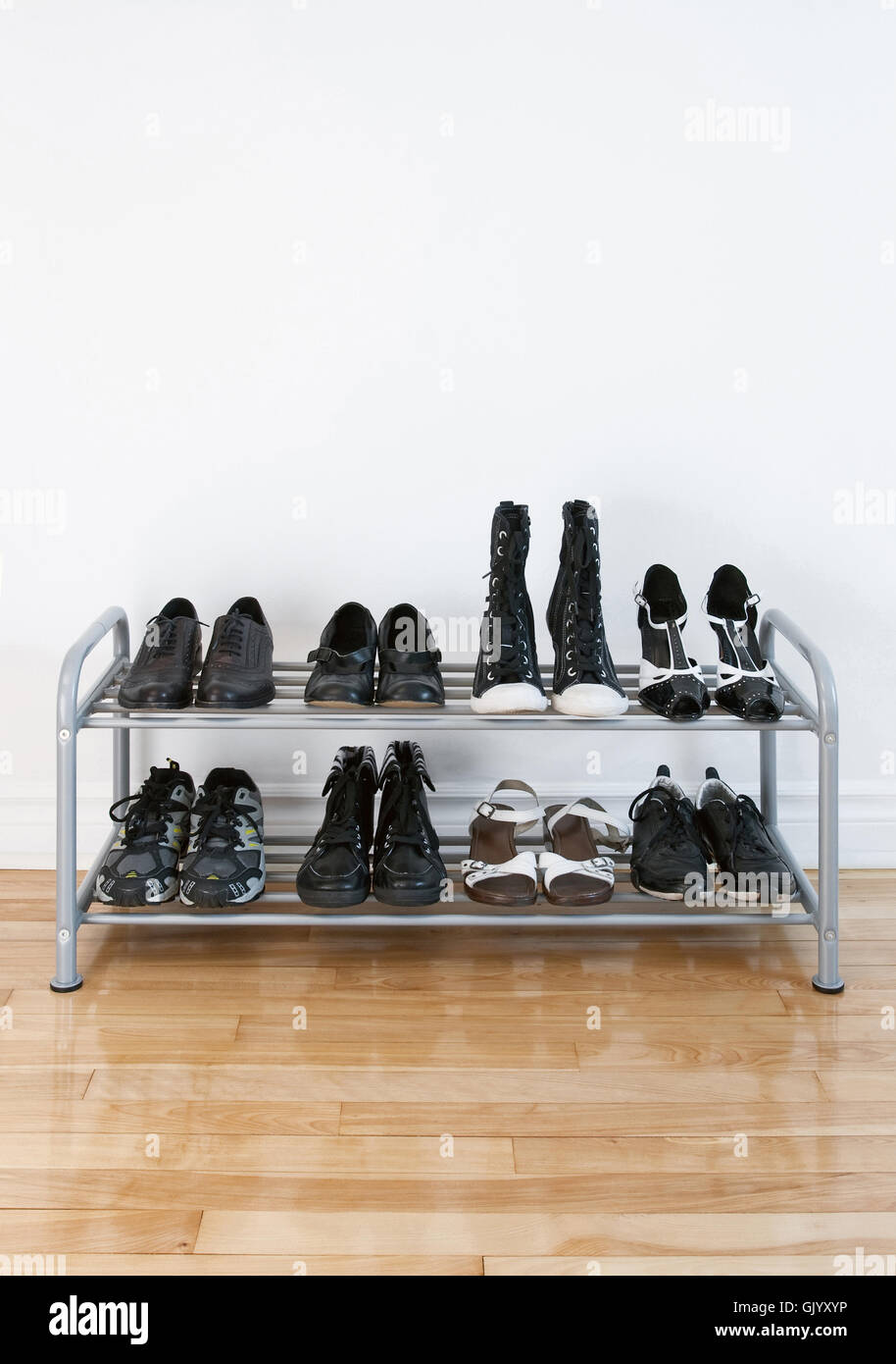 Shoe rack on a wooden floor Stock Photo - Alamy