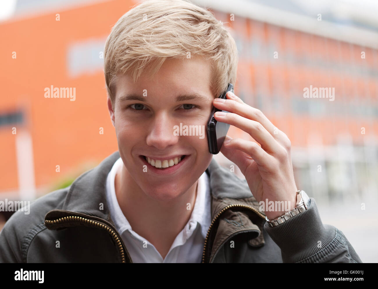 Young guy with cellphone Stock Photo - Alamy