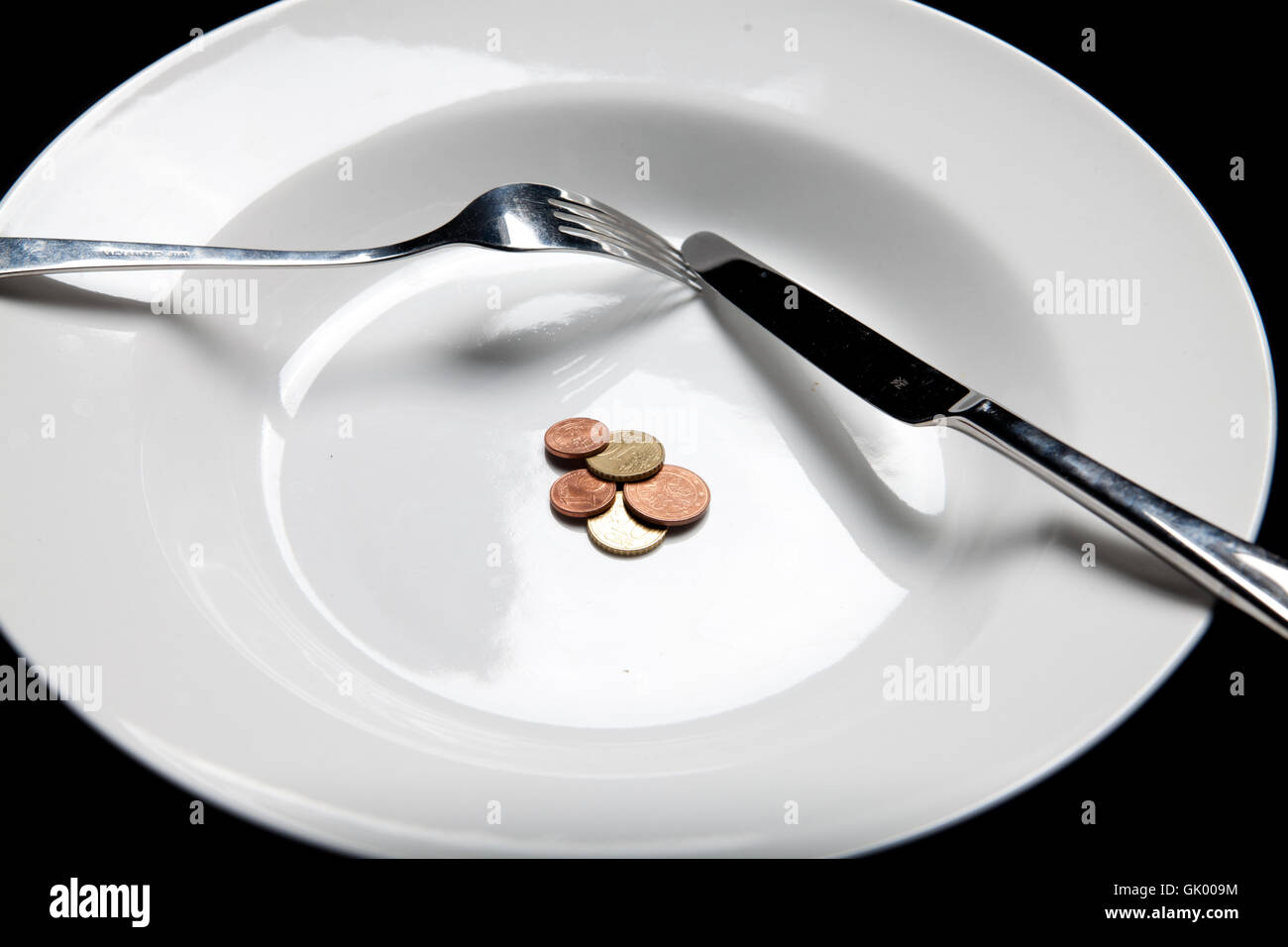 closeup money on a plate Stock Photo - Alamy