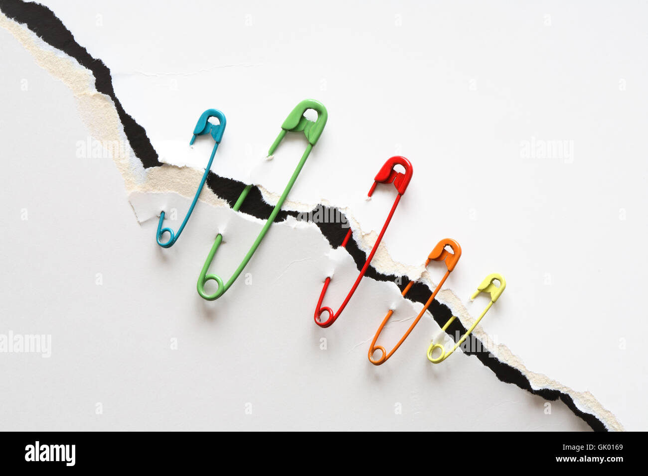 Safety Pins And Disrupt Paper Stock Photo - Alamy
