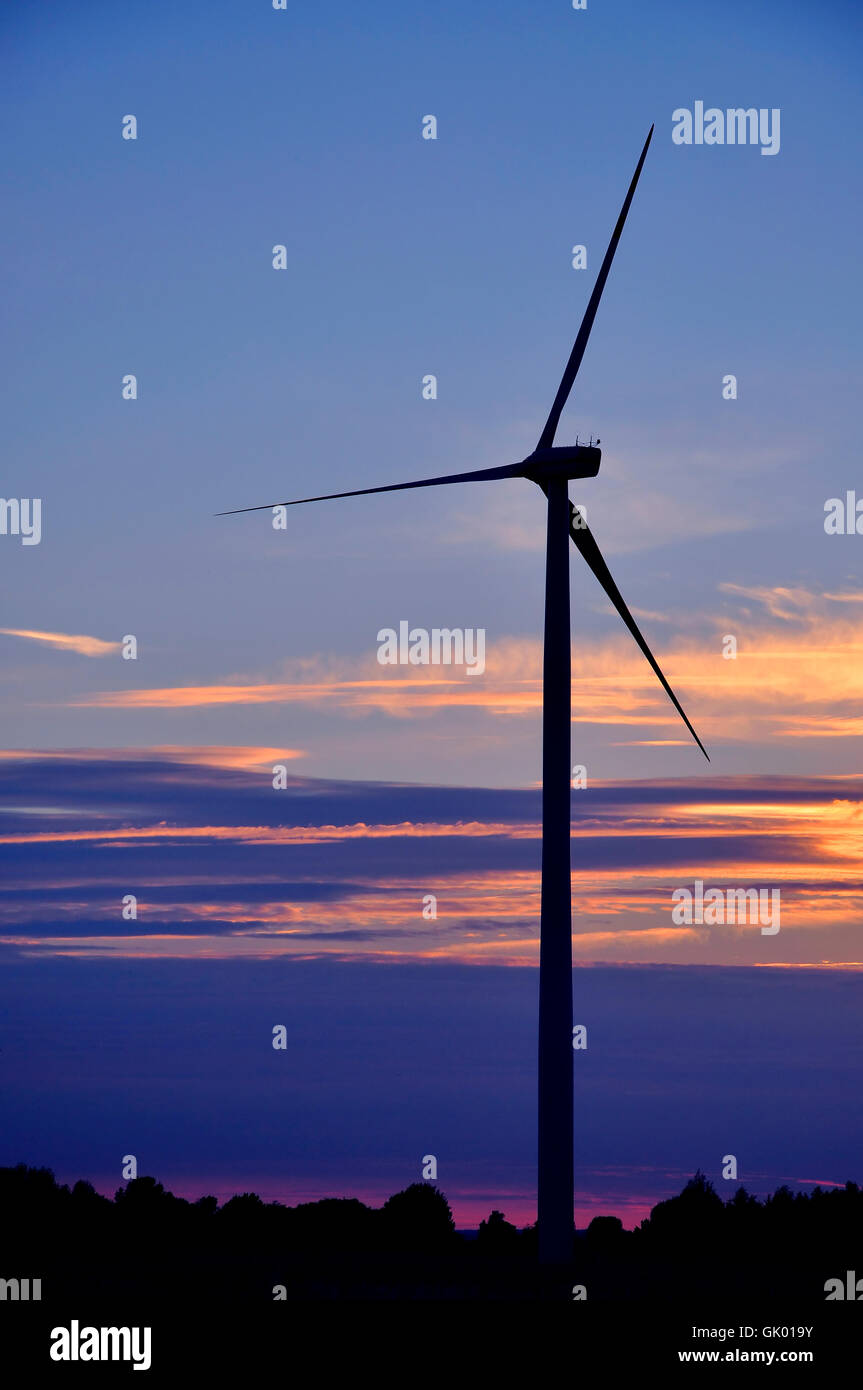 Wind turbine farm over sunset Stock Photo - Alamy