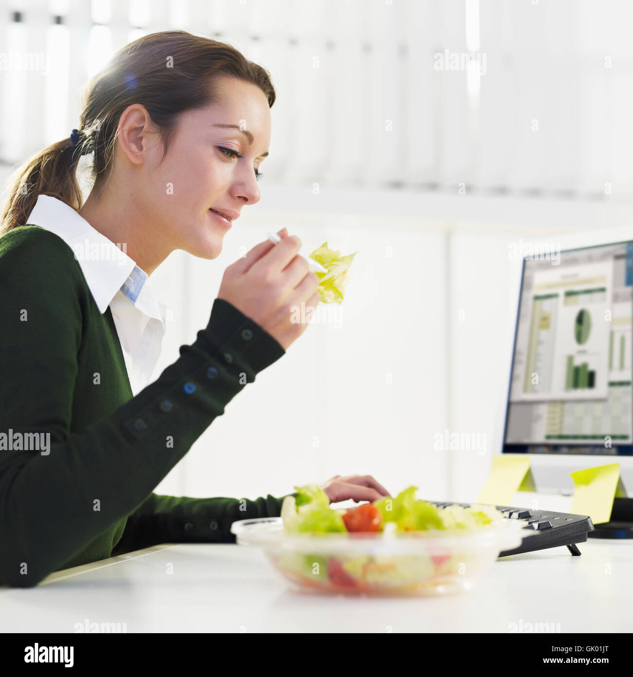 woman office food Stock Photo - Alamy