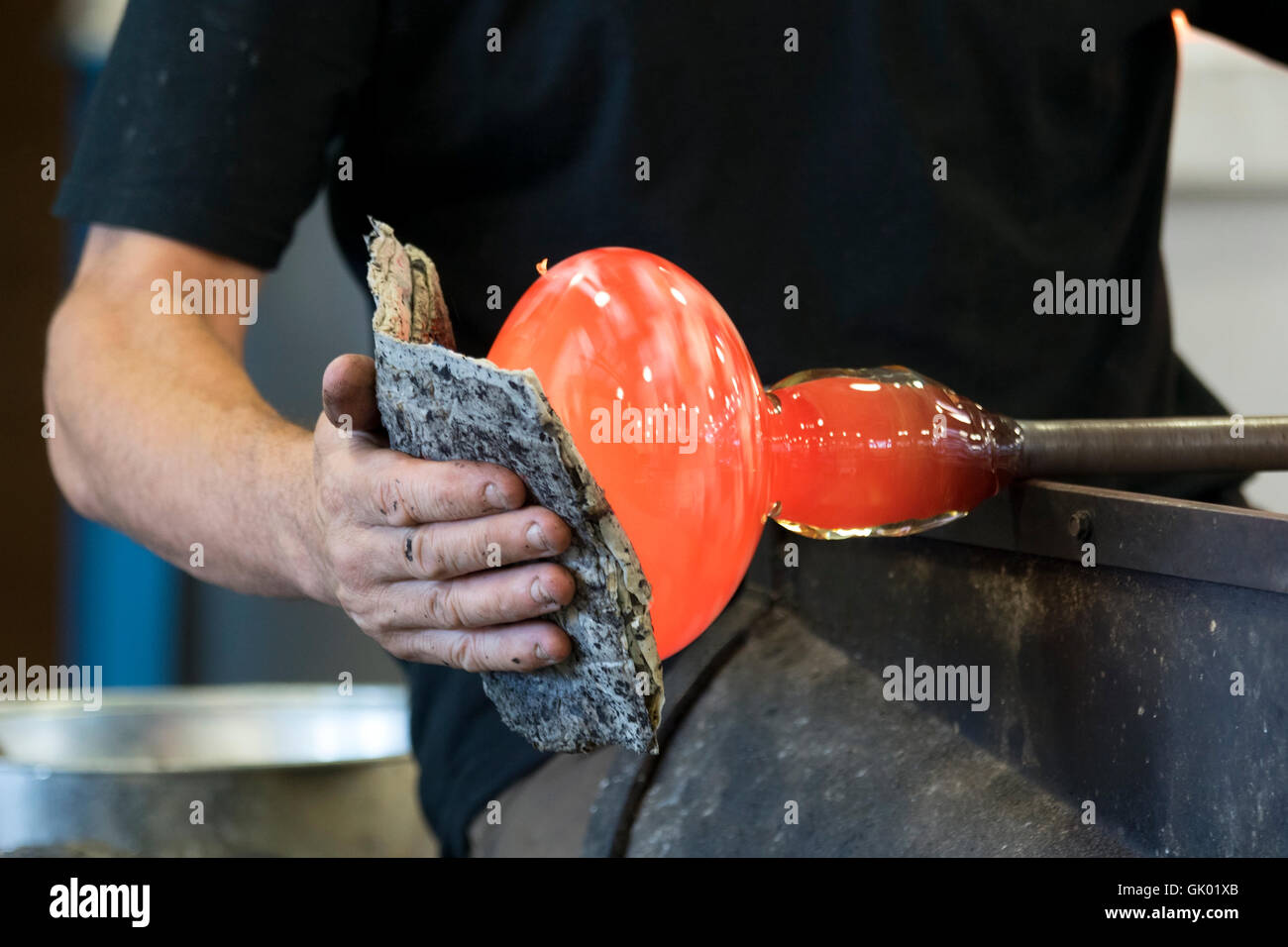 Glassblower working with hot glass Stock Photo - Alamy
