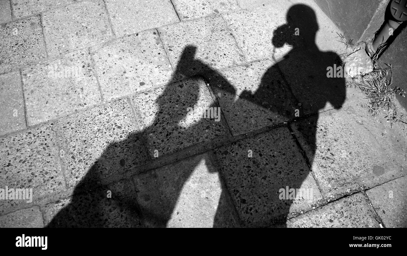 Shadows of two people Stock Photo - Alamy