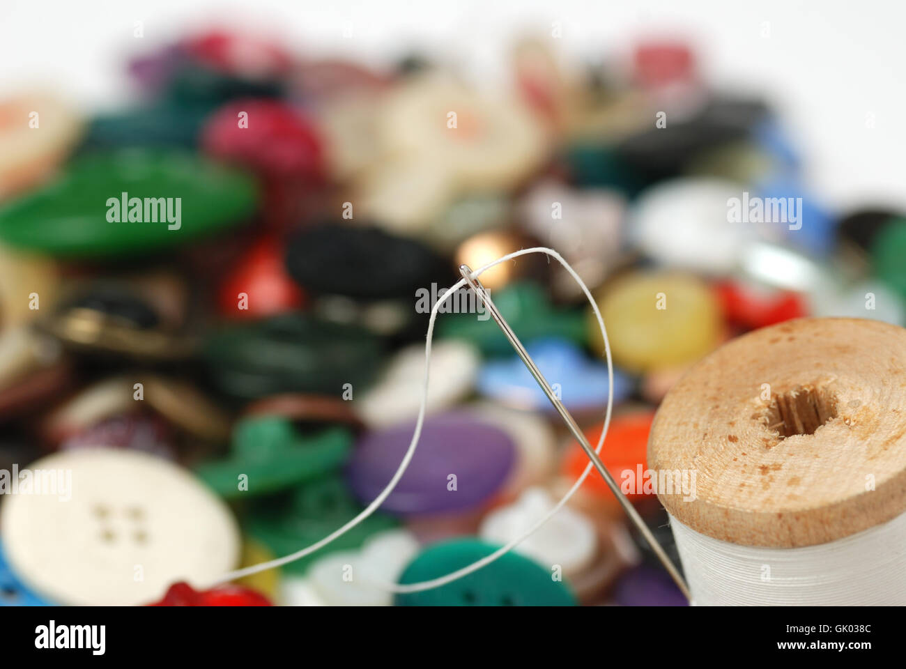 Needle and a thread Stock Photo - Alamy
