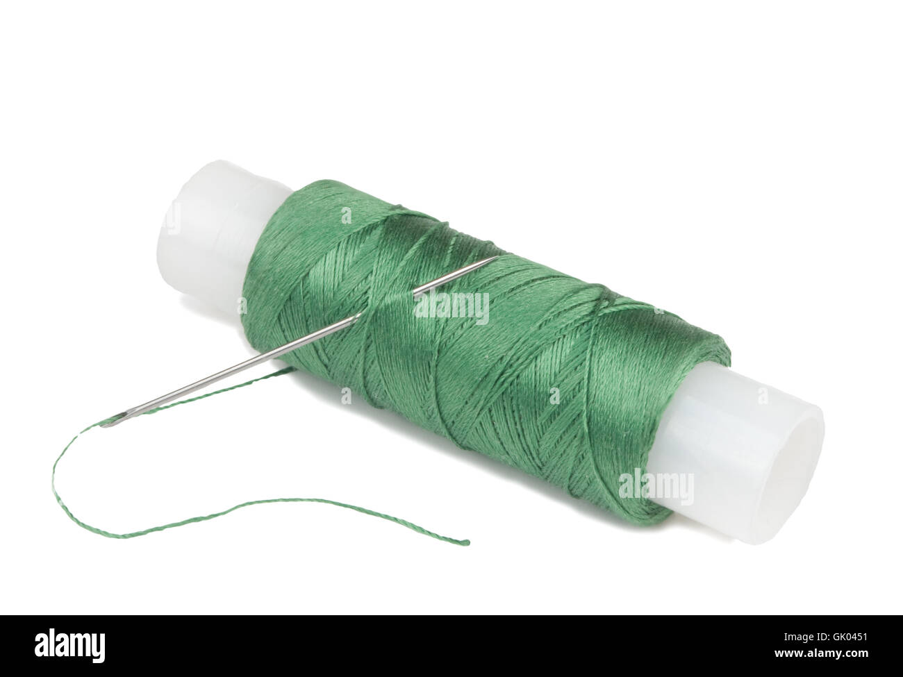 green spool with needle Stock Photo - Alamy