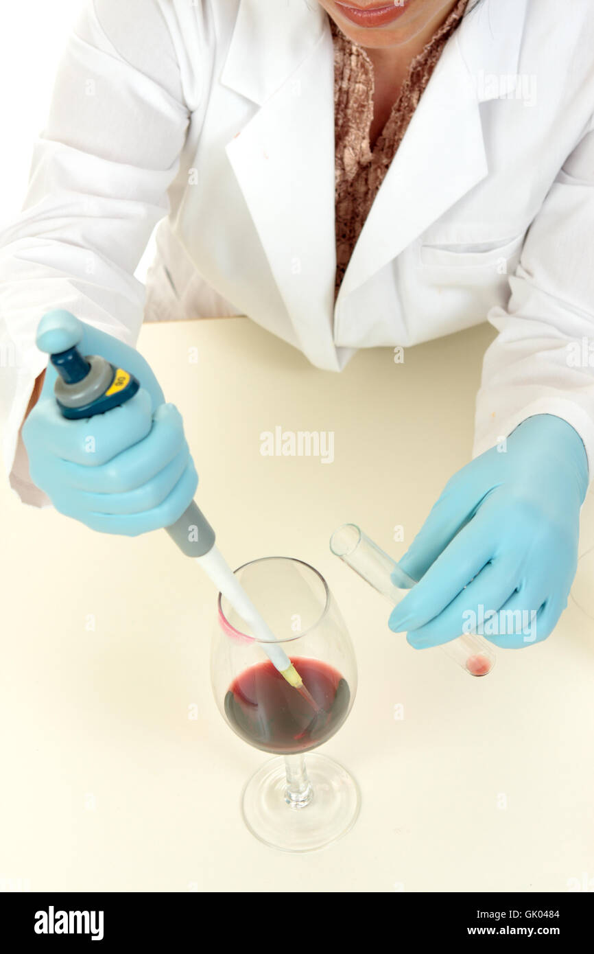 Scientist using pipette to take sample Stock Photo - Alamy