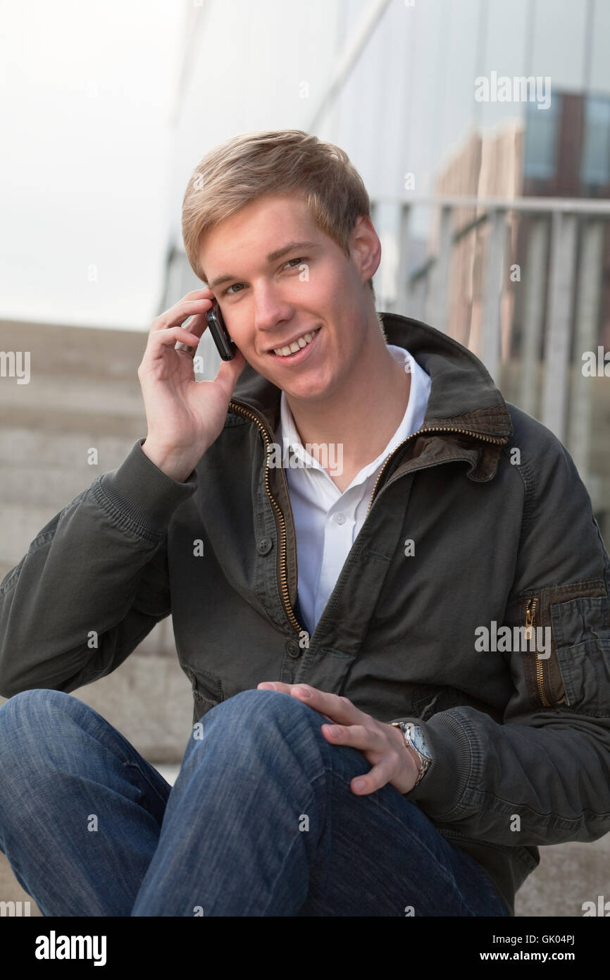 Young guy with cellphone Stock Photo - Alamy