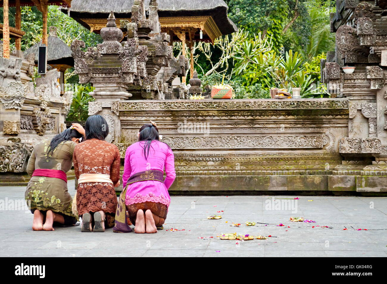 Indonesian woman praying Stock Photo - Alamy
