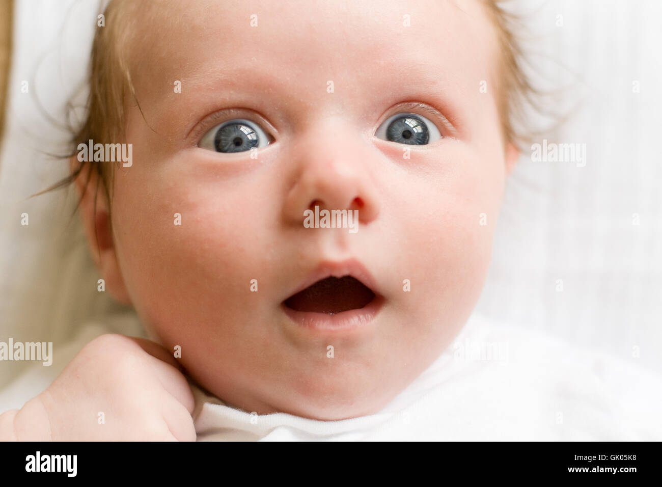 Infant looking in wonder hi-res stock photography and images - Alamy
