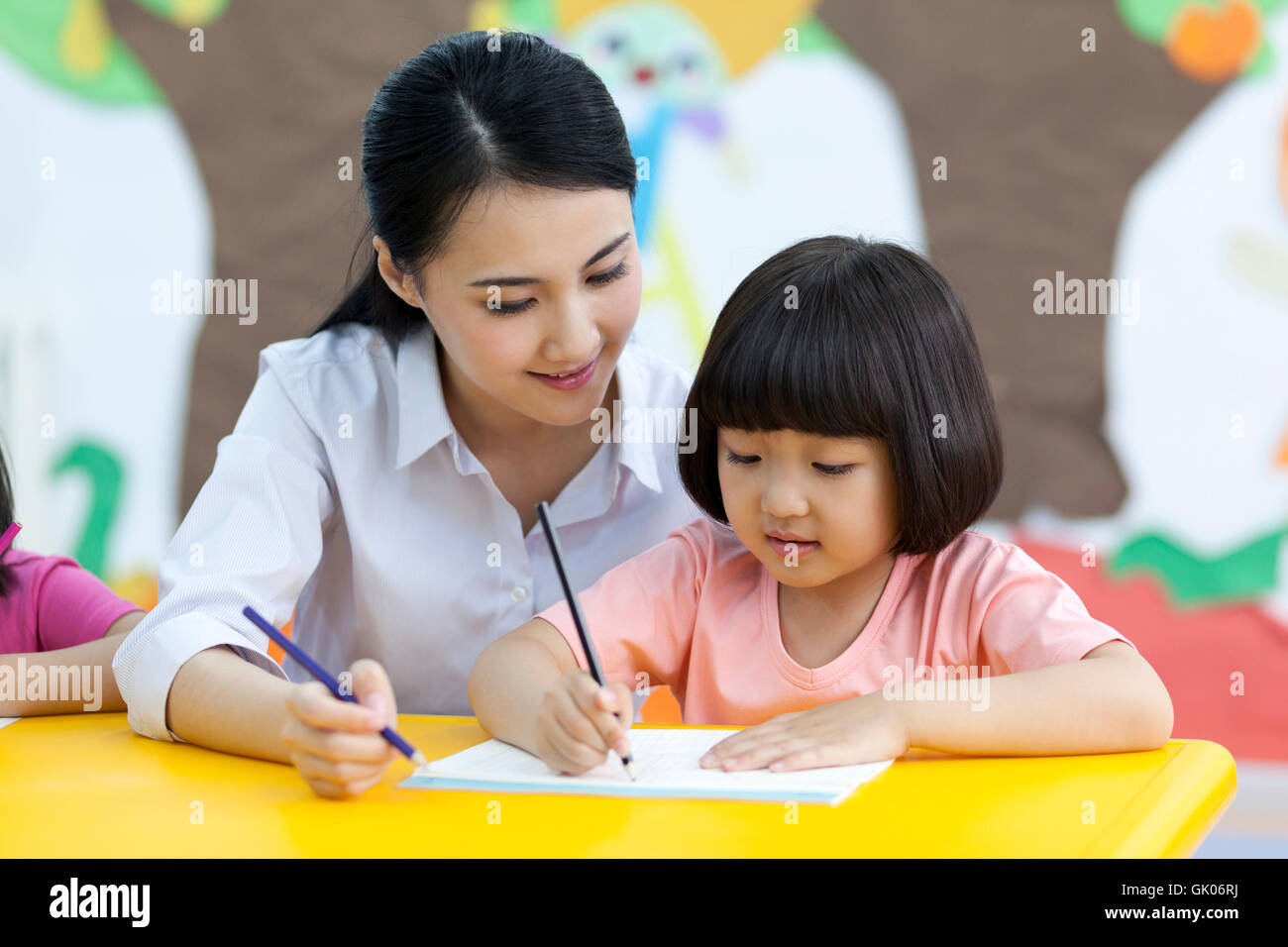 Female teachers children learning together hi-res stock photography and ...