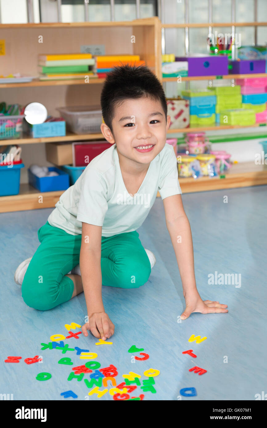 Children playing in kindergarten Stock Photo - Alamy