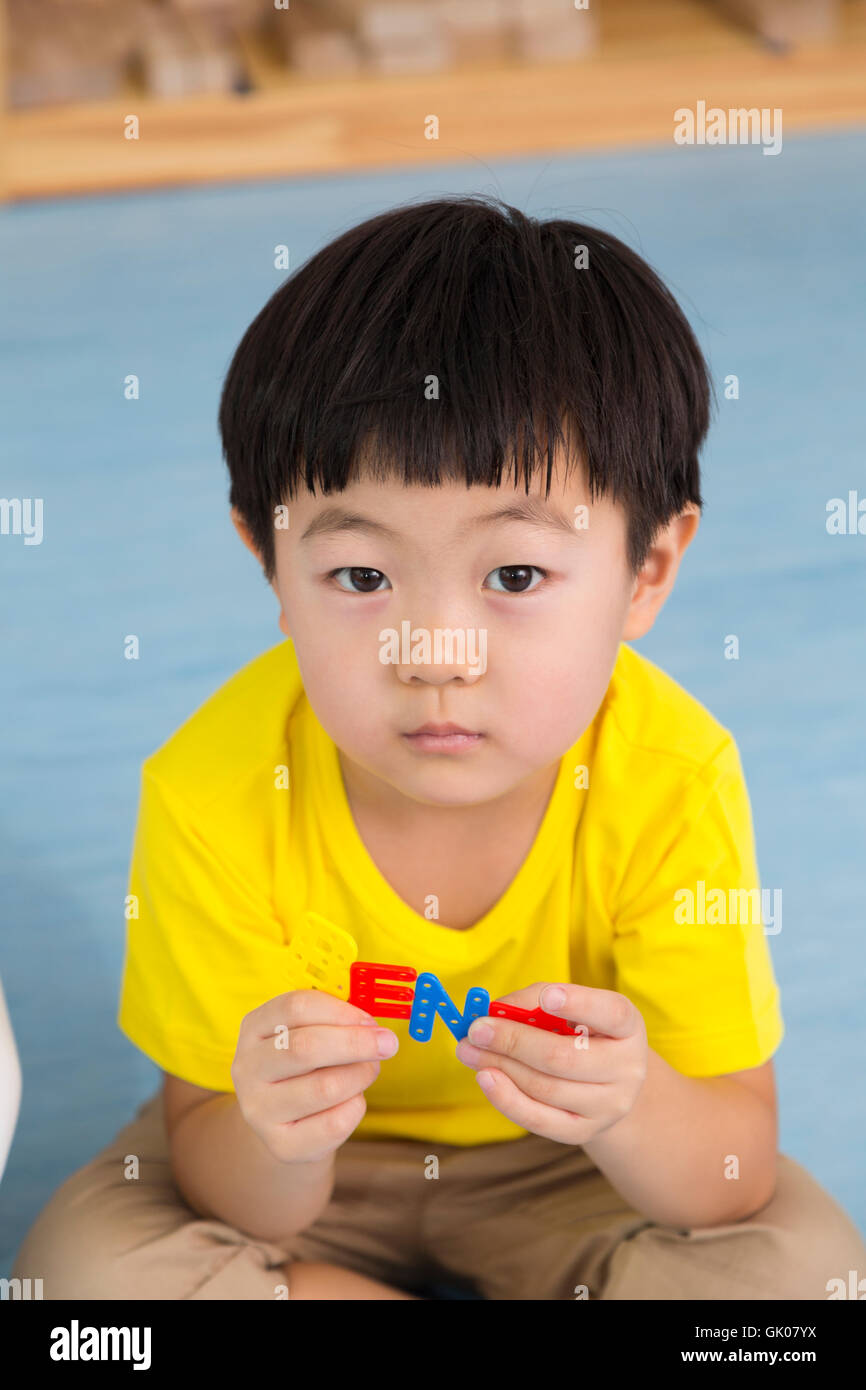 Children playing in kindergarten Stock Photo - Alamy