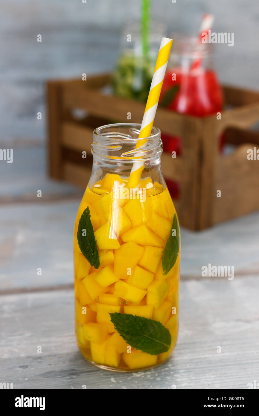 Detox fruit infused flavored water. Refreshing summer homemade cocktail ...