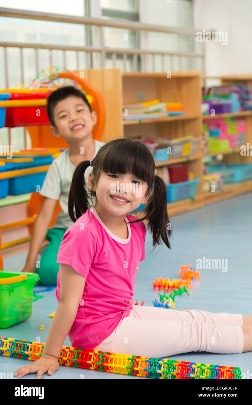Children playing in kindergarten Stock Photo - Alamy