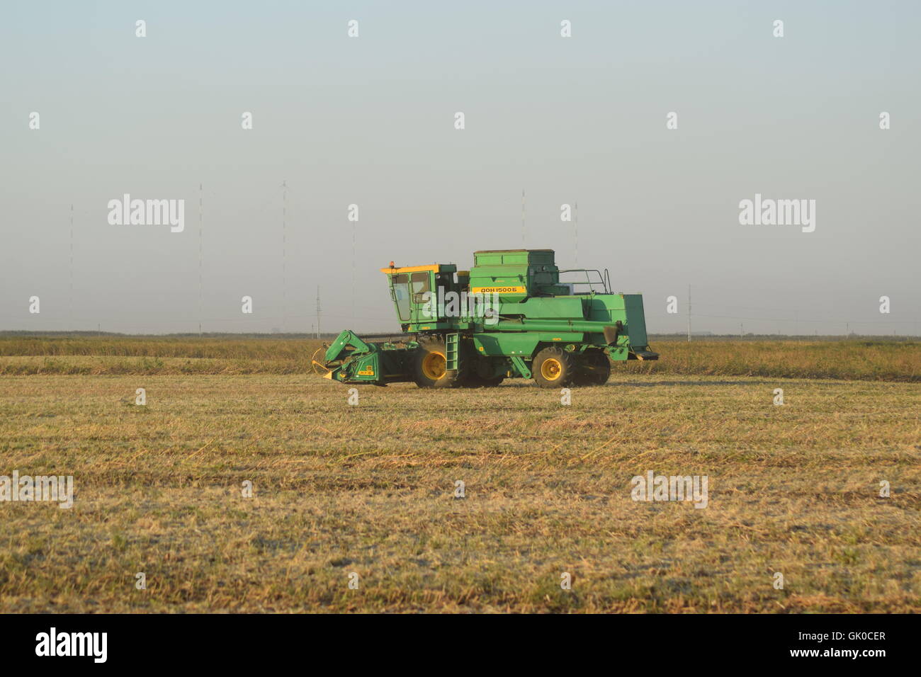 Soy harvesting by combines in the field. Agricultural machinery in ...