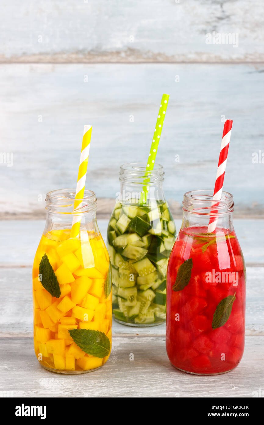 Detox fruit infused flavored water. Refreshing summer homemade cocktail ...