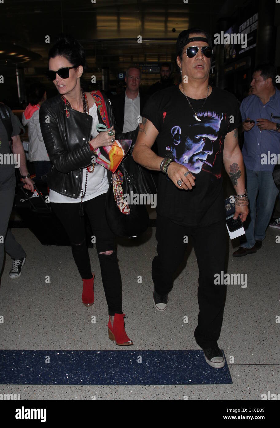 Slash and a female companion at Los Angeles International Airport (LAX ...
