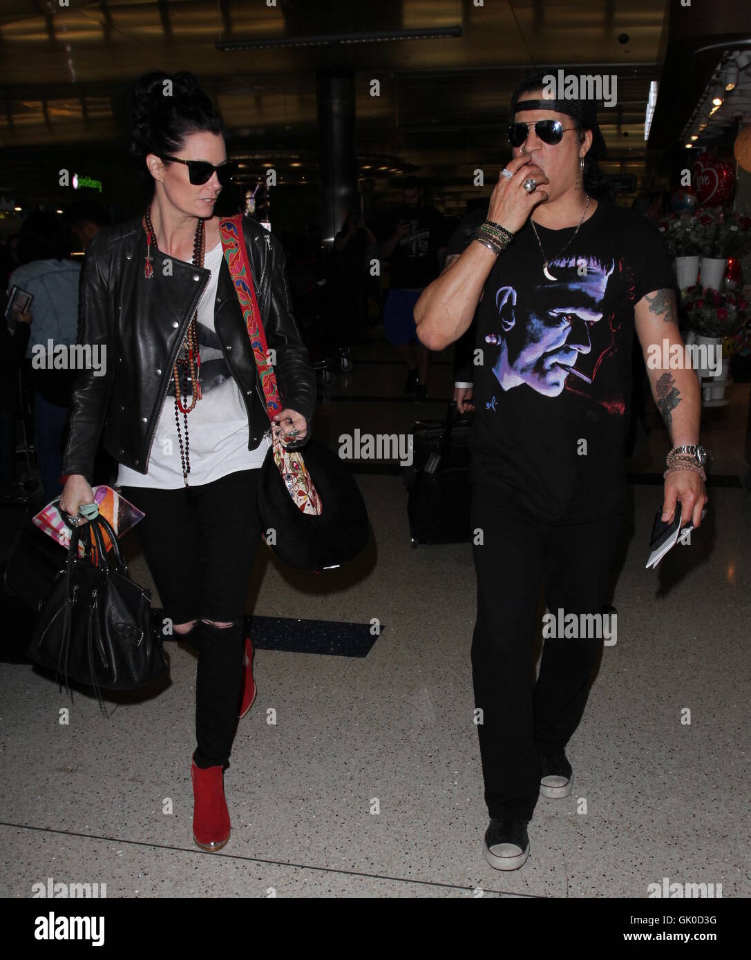 Slash and a female companion at Los Angeles International Airport (LAX ...