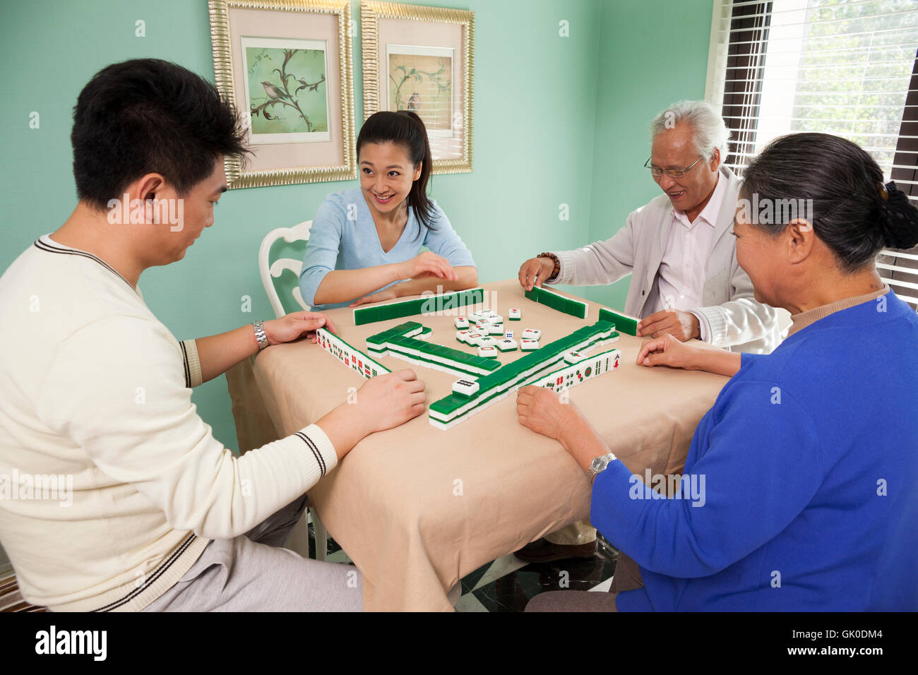 A people playing mahjong Stock Photo - Alamy