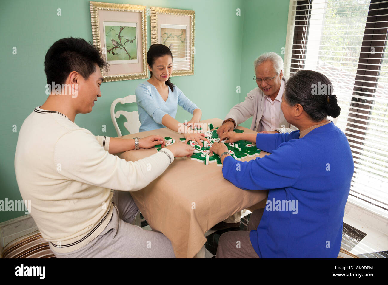 A people playing mahjong Stock Photo - Alamy