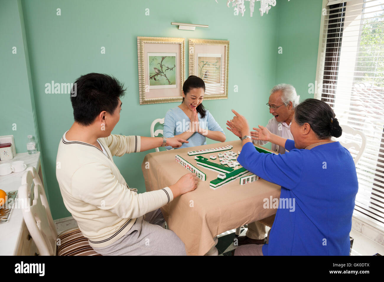 A people playing mahjong Stock Photo - Alamy