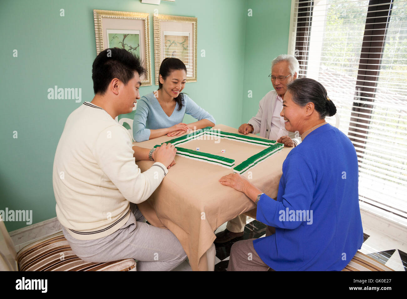 A people playing mahjong Stock Photo - Alamy