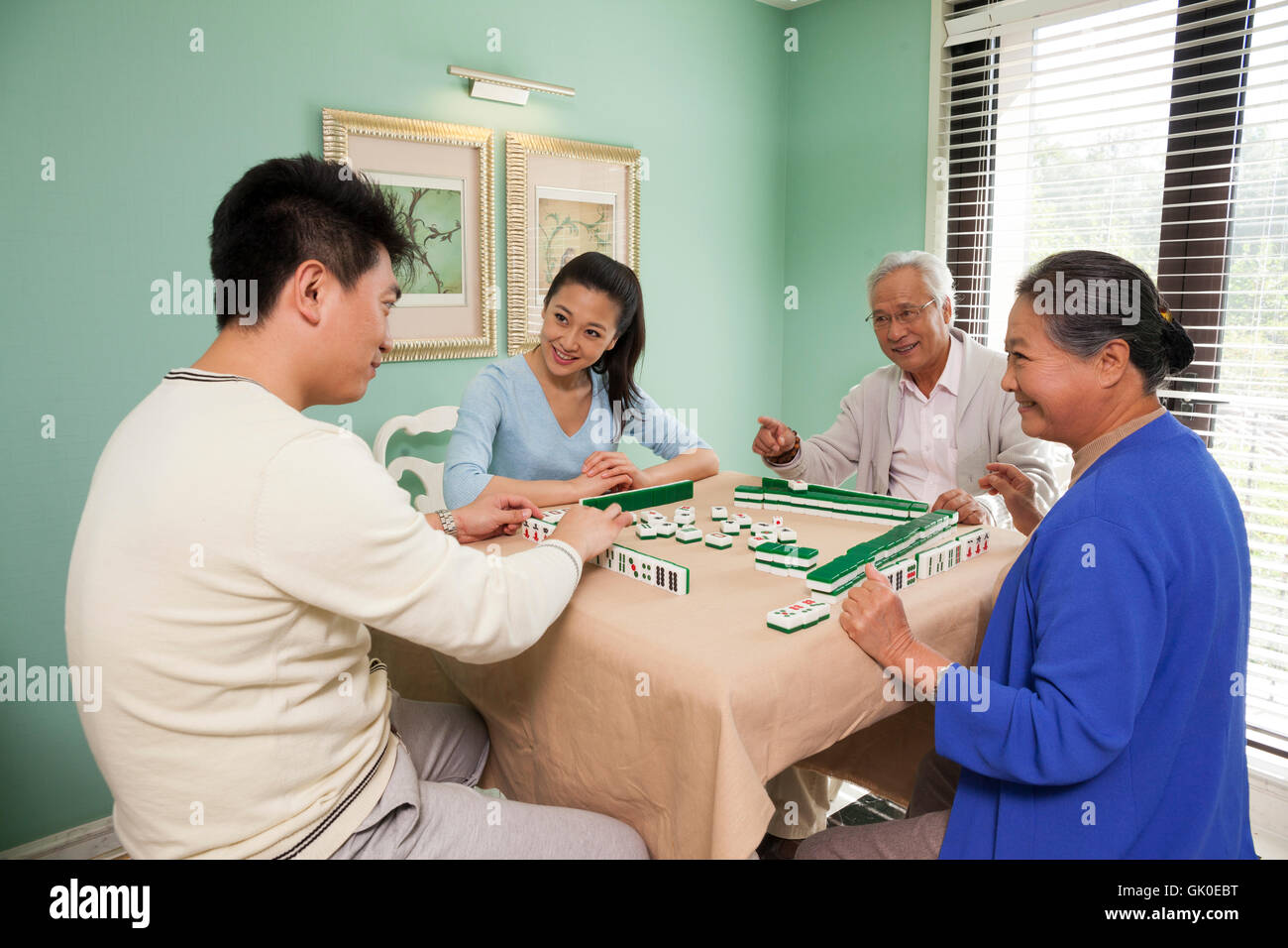 A people playing mahjong Stock Photo - Alamy