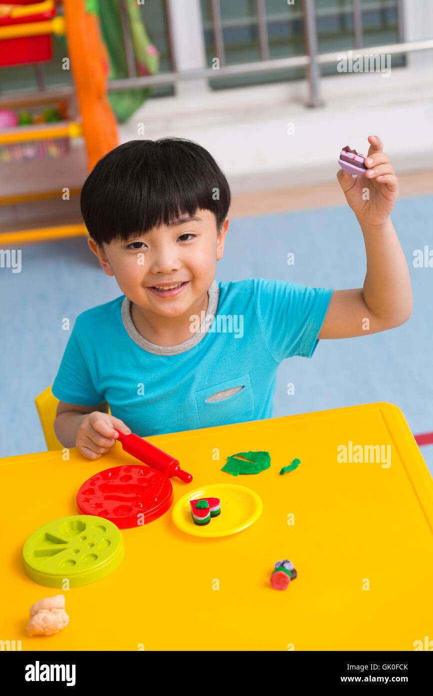 Children playing in kindergarten Stock Photo - Alamy
