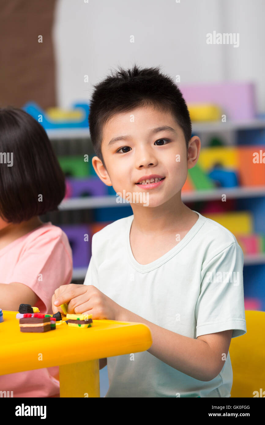 Children playing in kindergarten Stock Photo - Alamy