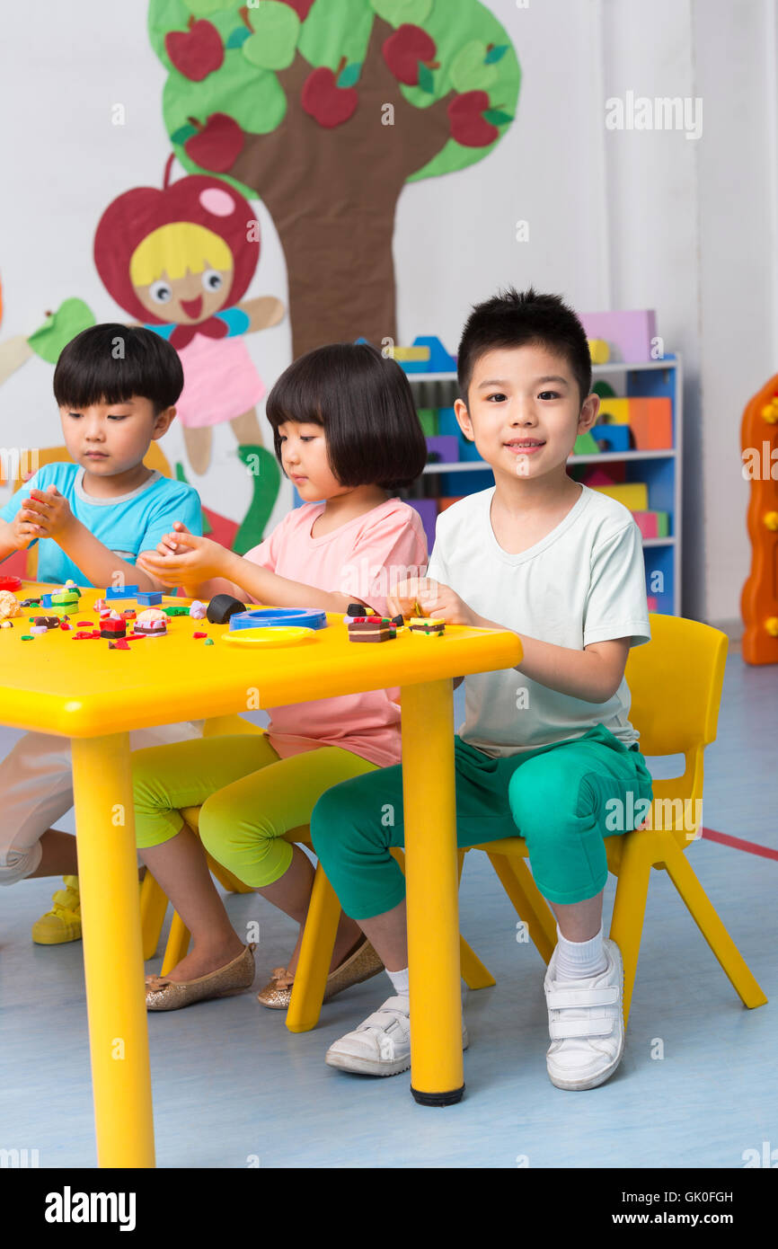 Children playing in kindergarten Stock Photo - Alamy