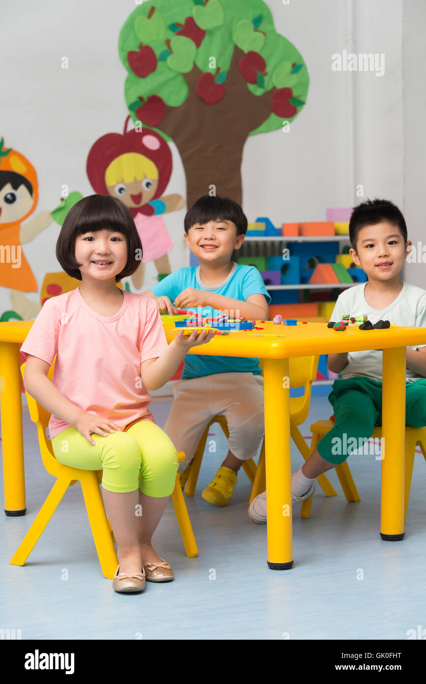 Children playing in kindergarten Stock Photo - Alamy