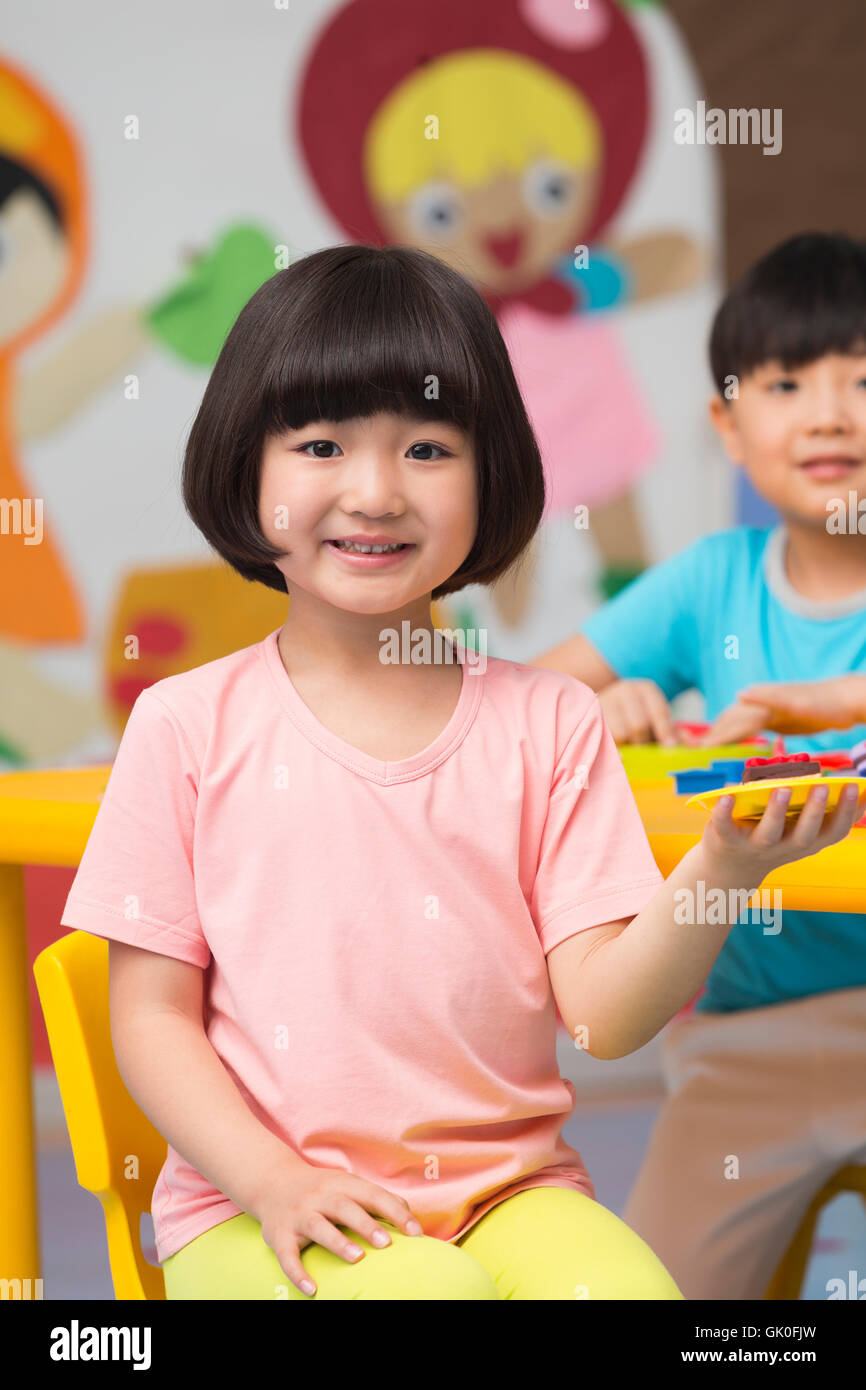 Children playing in kindergarten Stock Photo - Alamy
