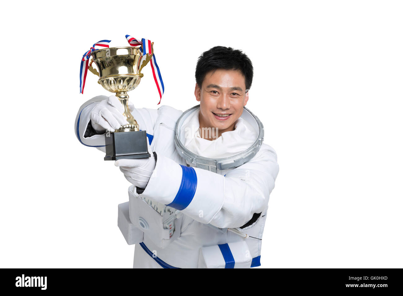 Studio shot male astronauts show trophy Stock Photo - Alamy