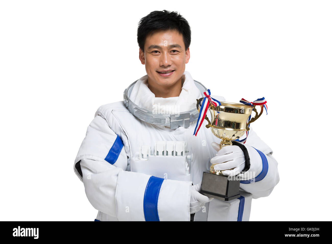Studio shot male astronauts show trophy Stock Photo - Alamy