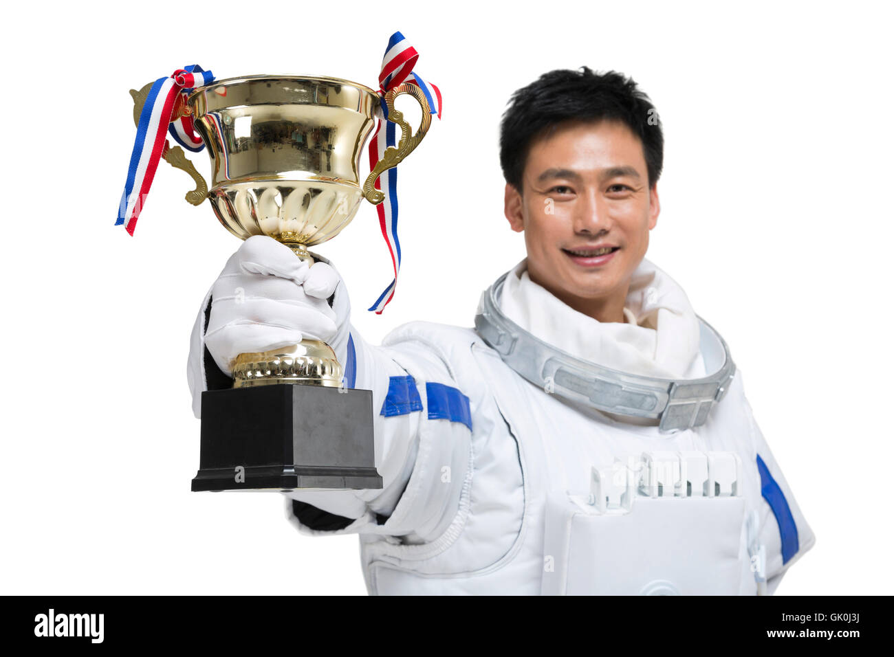 Studio shot male astronauts show trophy Stock Photo - Alamy
