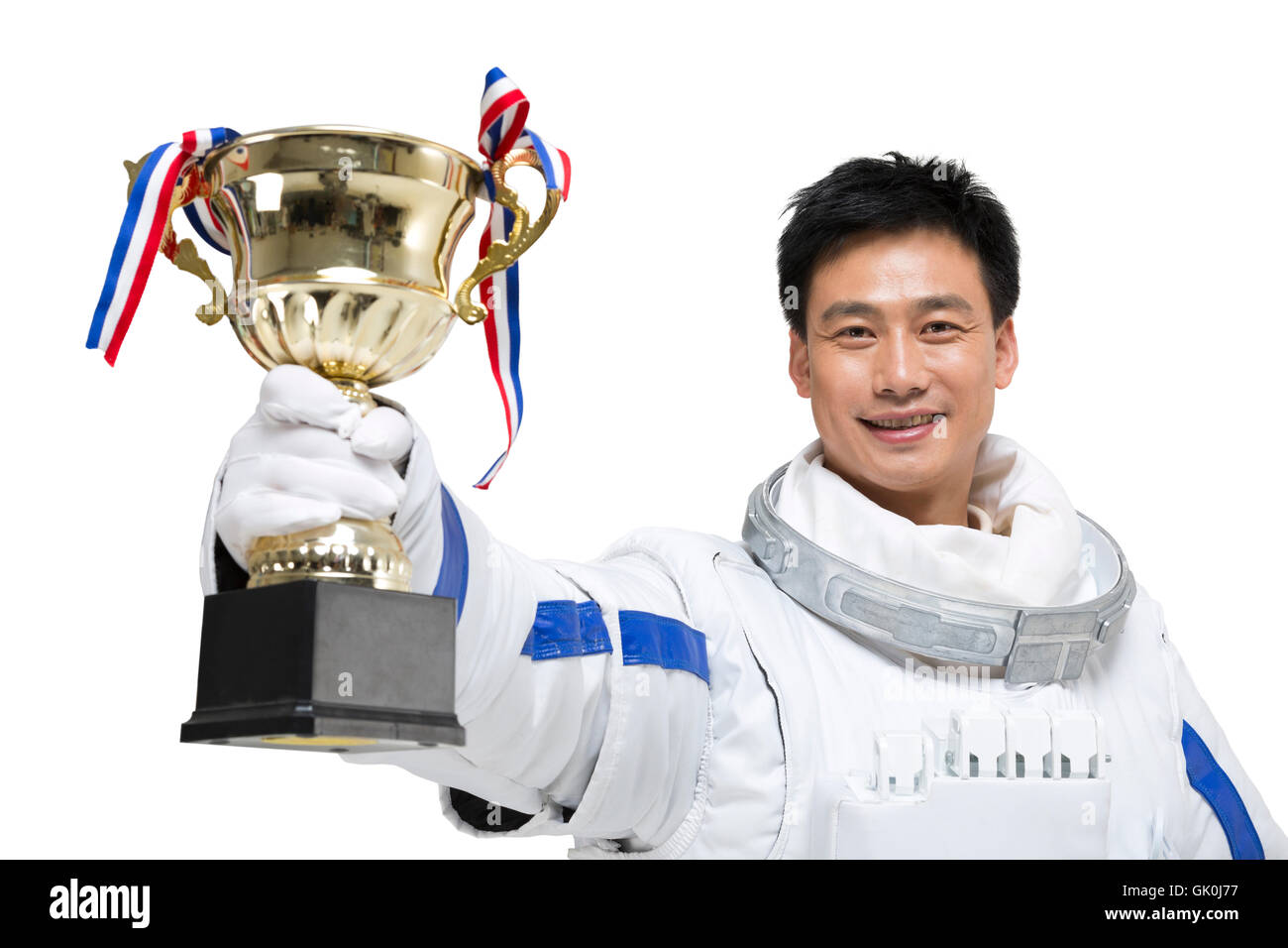 Studio shot male astronauts show trophy Stock Photo - Alamy