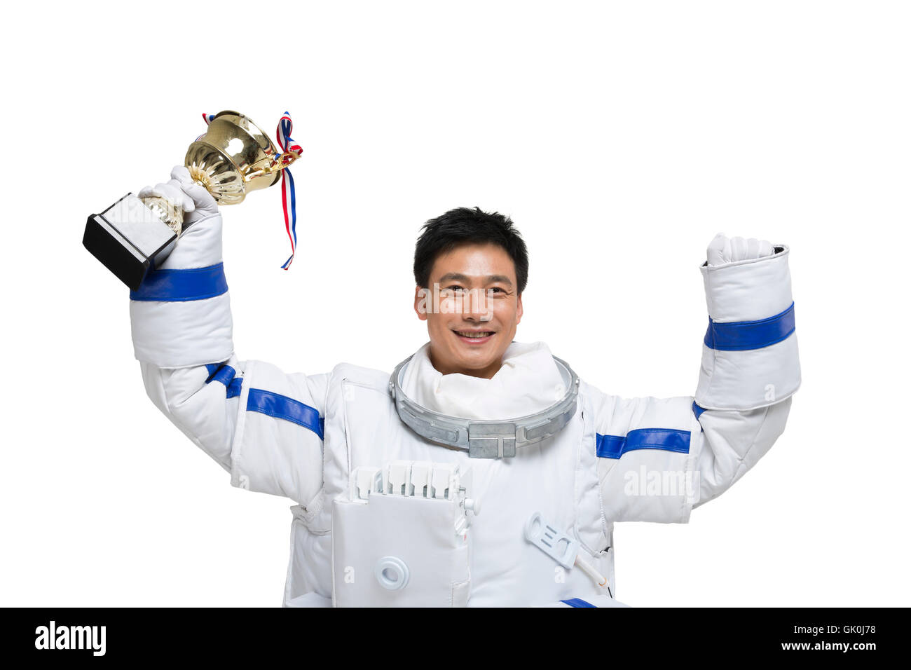 Studio shot male astronauts show trophy Stock Photo - Alamy