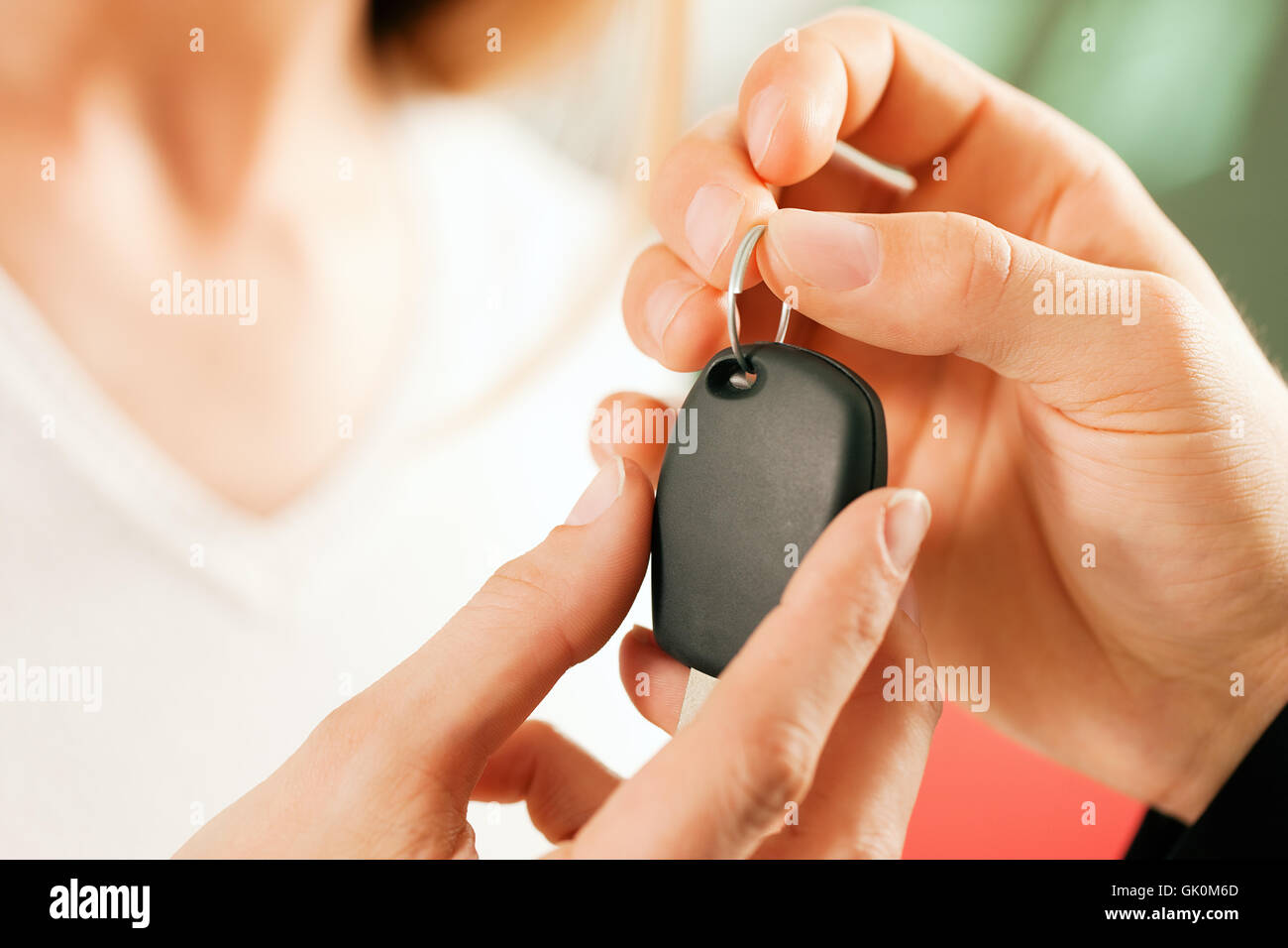 woman buying car - key handover Stock Photo - Alamy