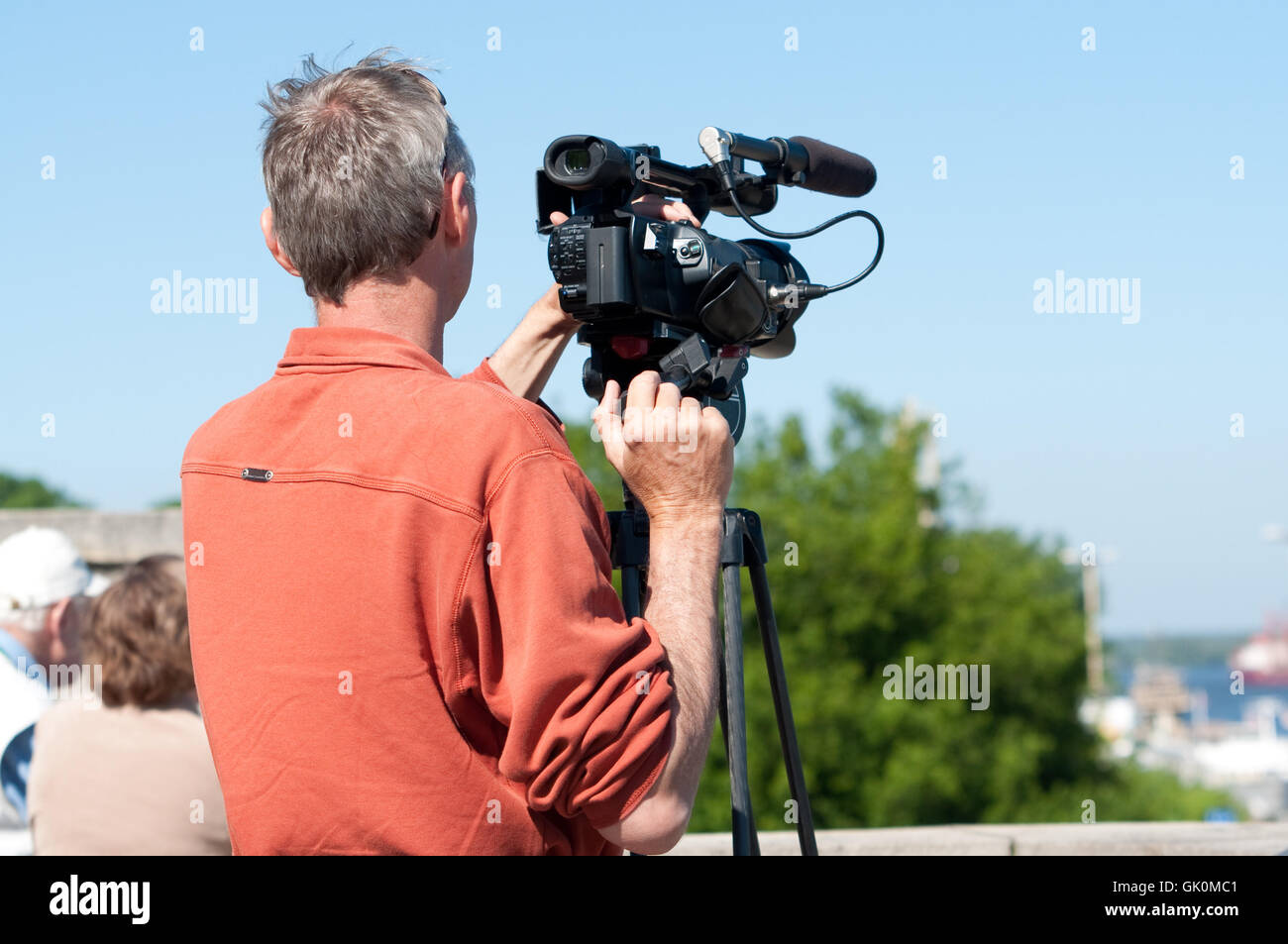 man with the video camera Stock Photo - Alamy