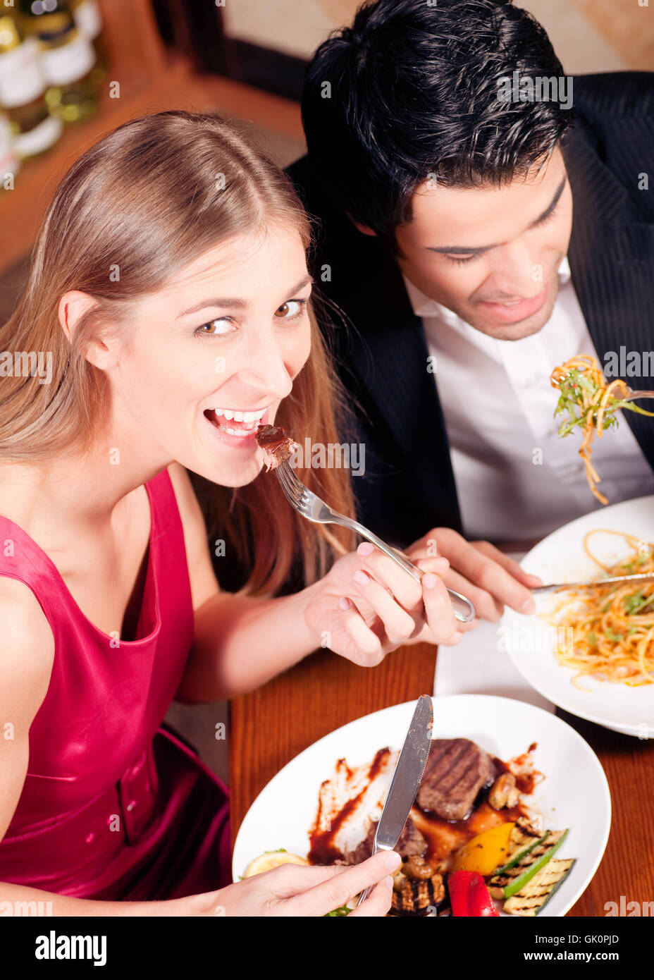 Couple eating steak restaurant hi-res stock photography and images - Alamy