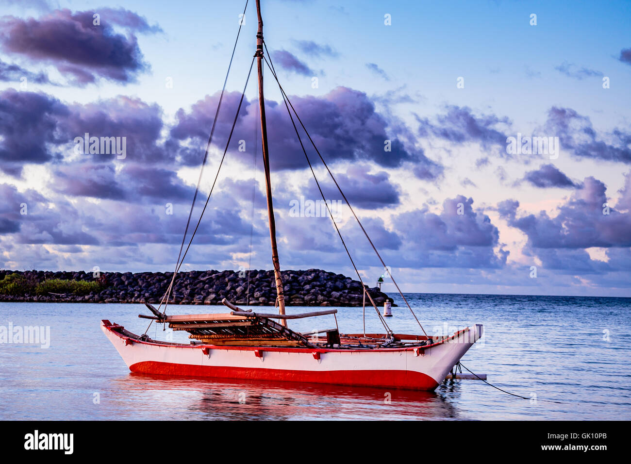 A micronesian tribal catamaran at anchor at the mouth of the bay Stock ...