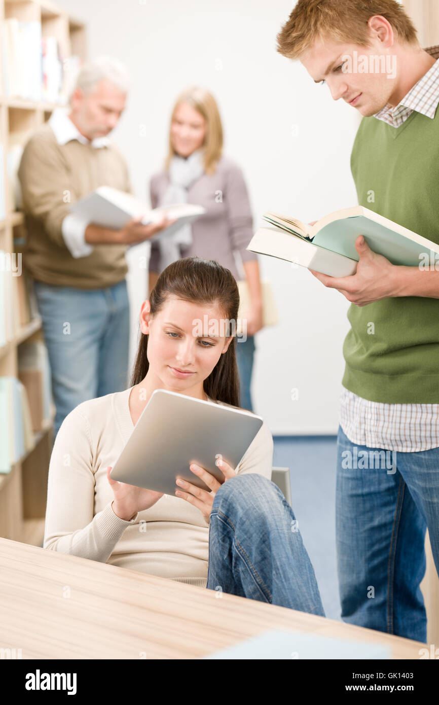 woman library tablet Stock Photo - Alamy