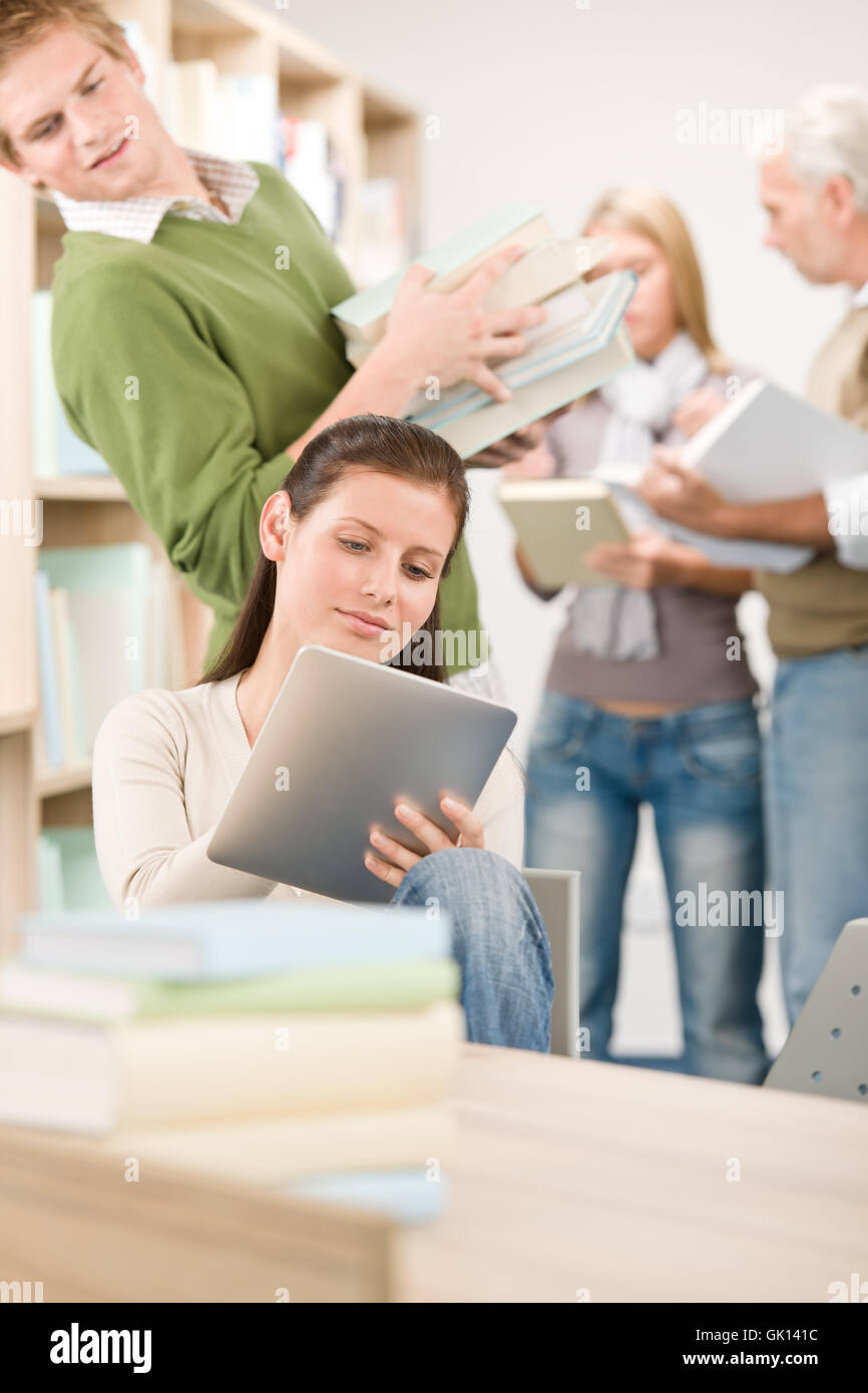 woman library tablet Stock Photo - Alamy